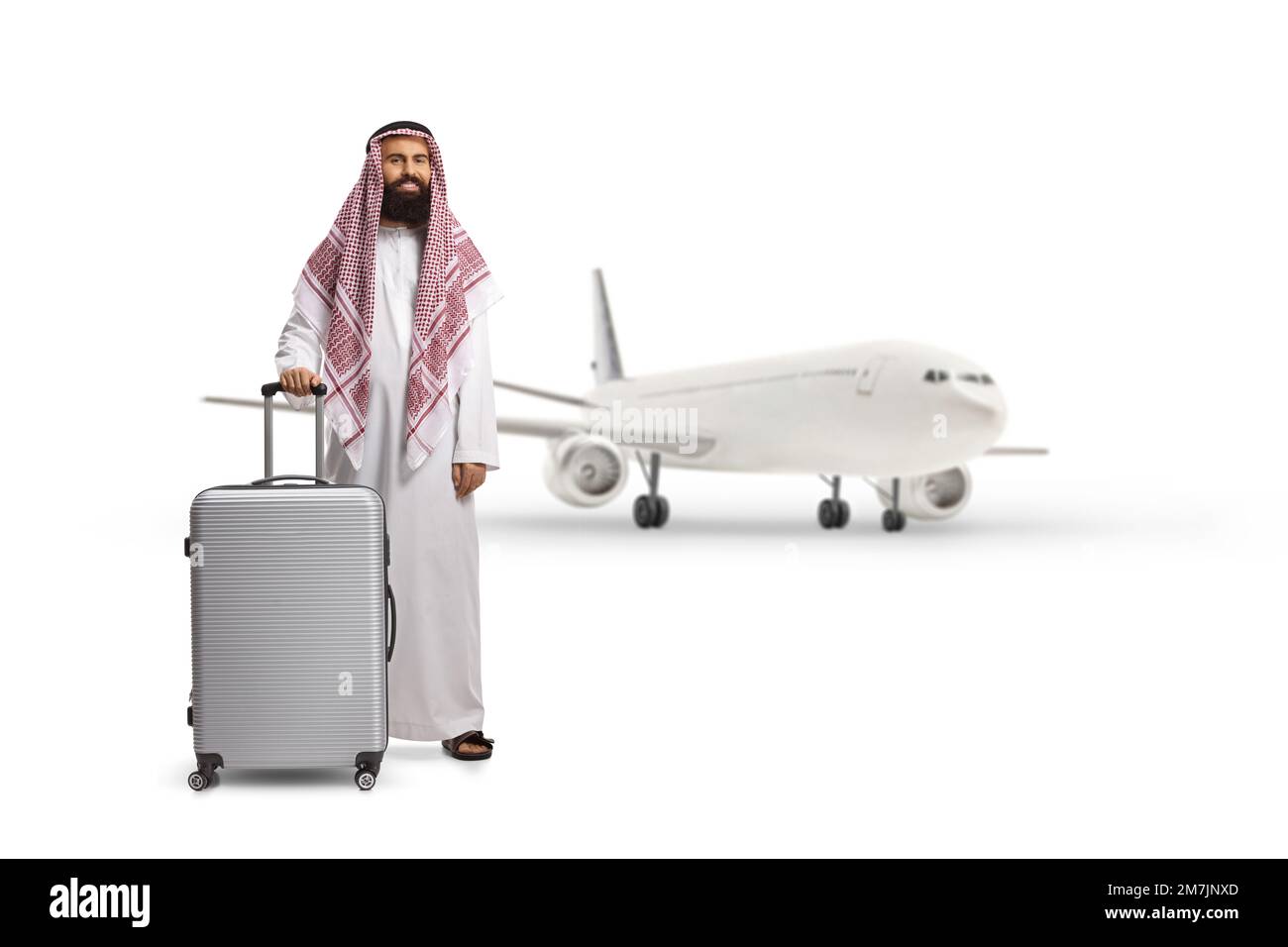 Full length portrait of a saudi arab man in a thobe posing with a ...