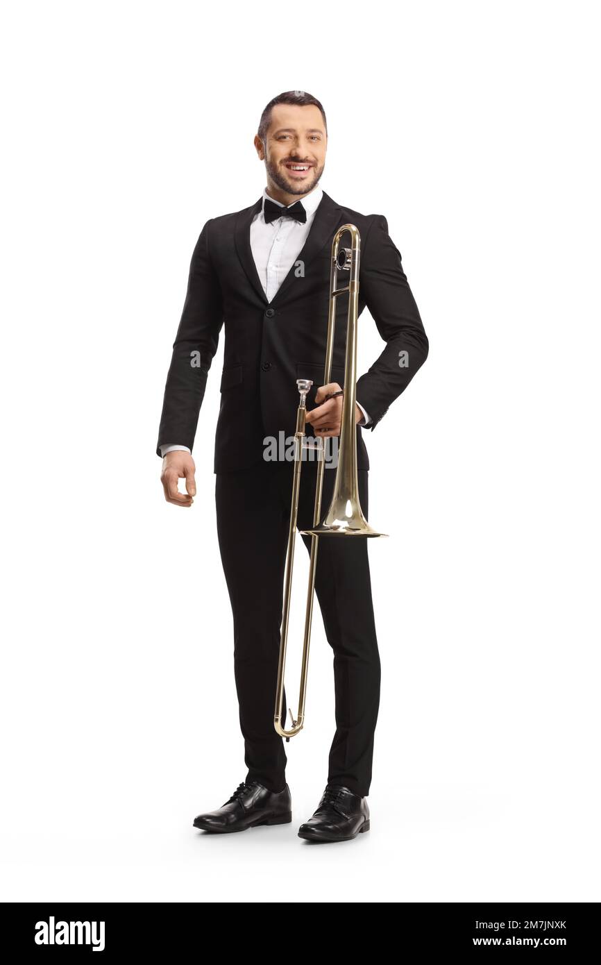 Full length portrait of a male musician posing with a trombone isolated ...
