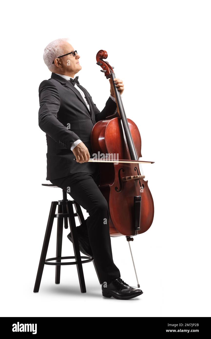 Profile shot of a mature musician sitting on a chair with a cello ...