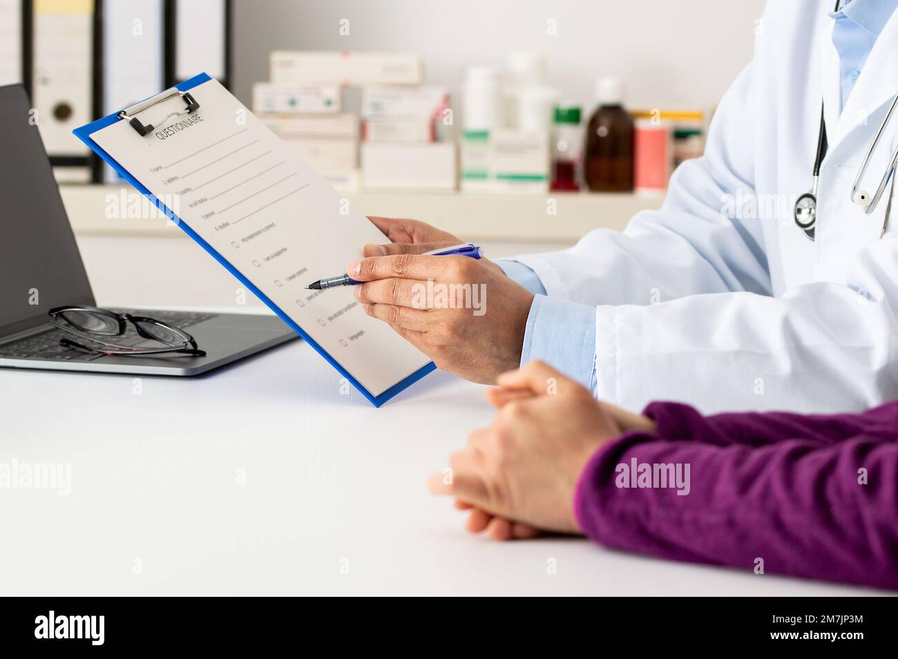 Doctor prescribing medicine during medical hi-res stock photography and ...