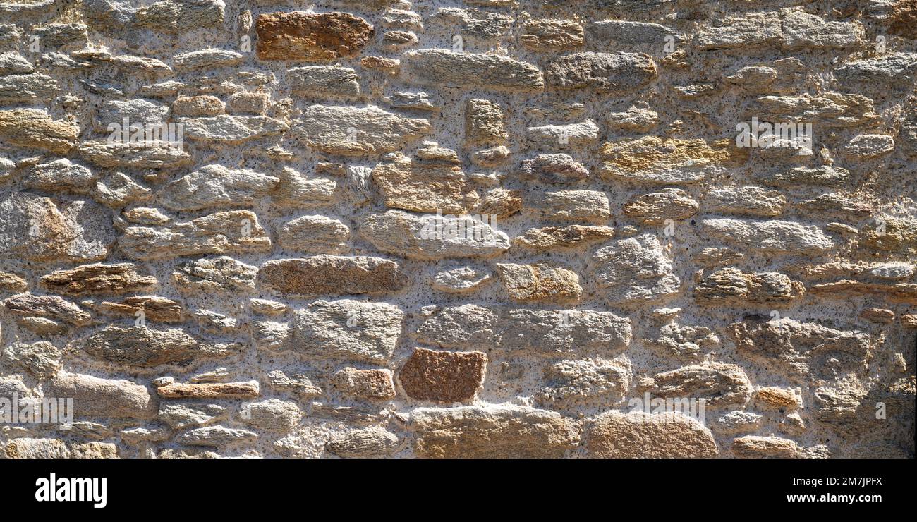 background stone hands made wall with large small natural stones Stock ...