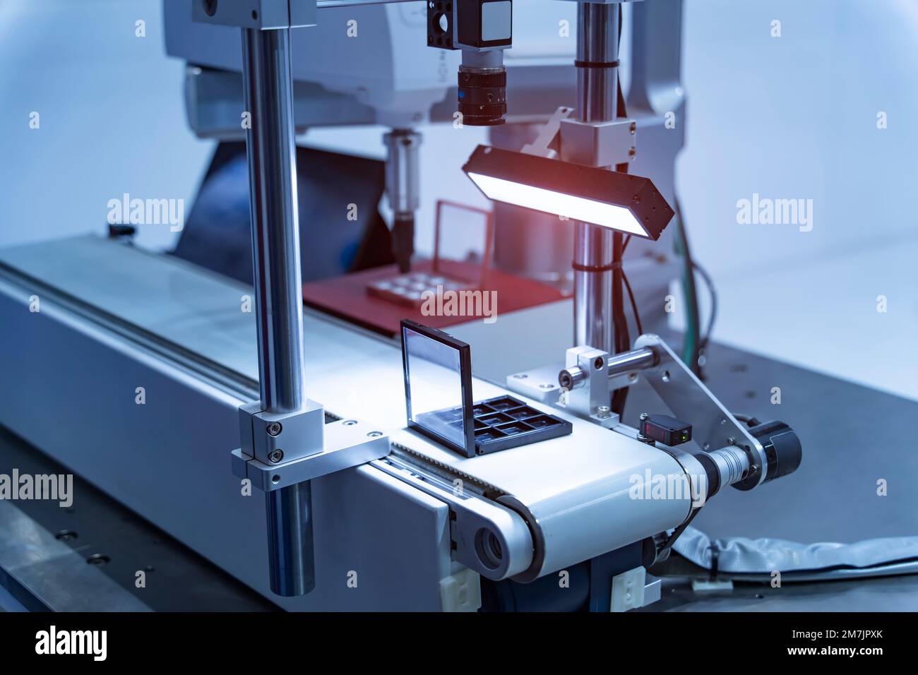 robotic arm manipulator moving on conveyor belt. Manufacturing ...