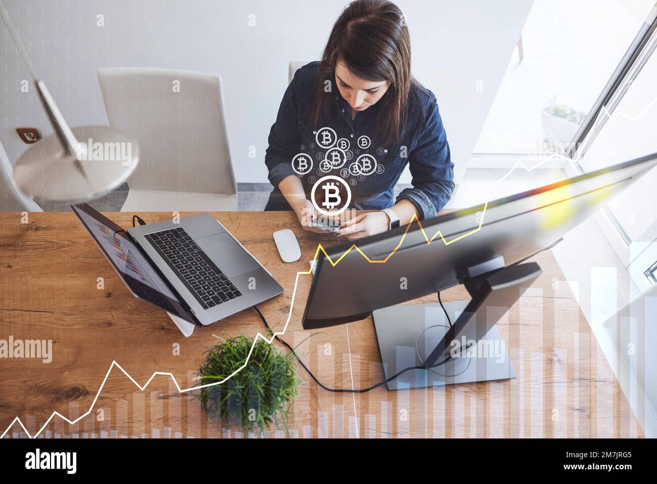 Top down view of a business woman sitting by her office desk working ...