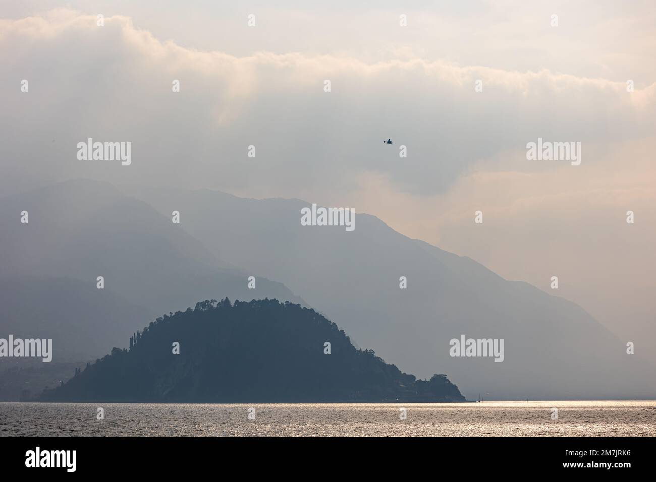 Dramatic Light Rays Over Lake Como, Italy with Islands and Hills in the ...