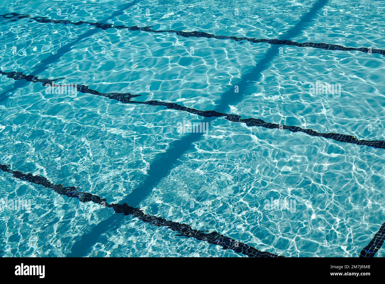 Blue swimming pool rippled water detail square liner Stock Photo - Alamy