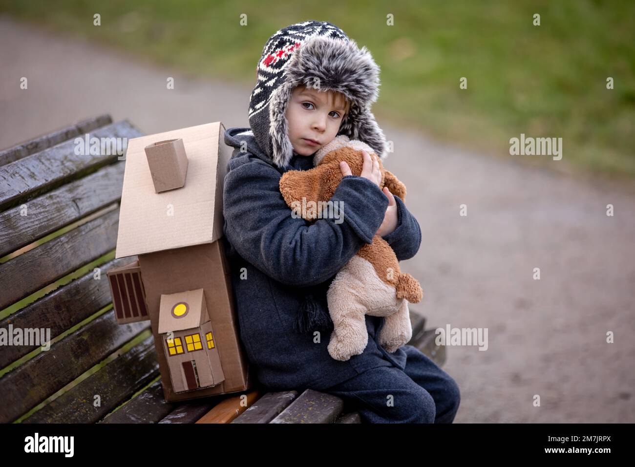 Little child, blond boy with pet dog, carying home on his back, kid ...