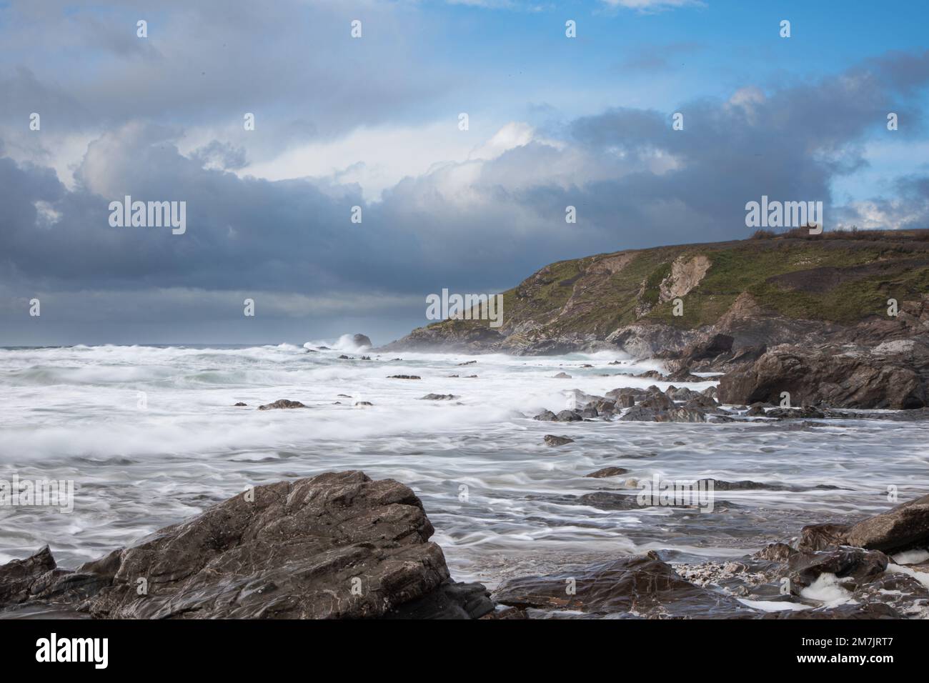 Storm approaching a rocky Cornish beach at Dollar Cove The Lizard Stock ...