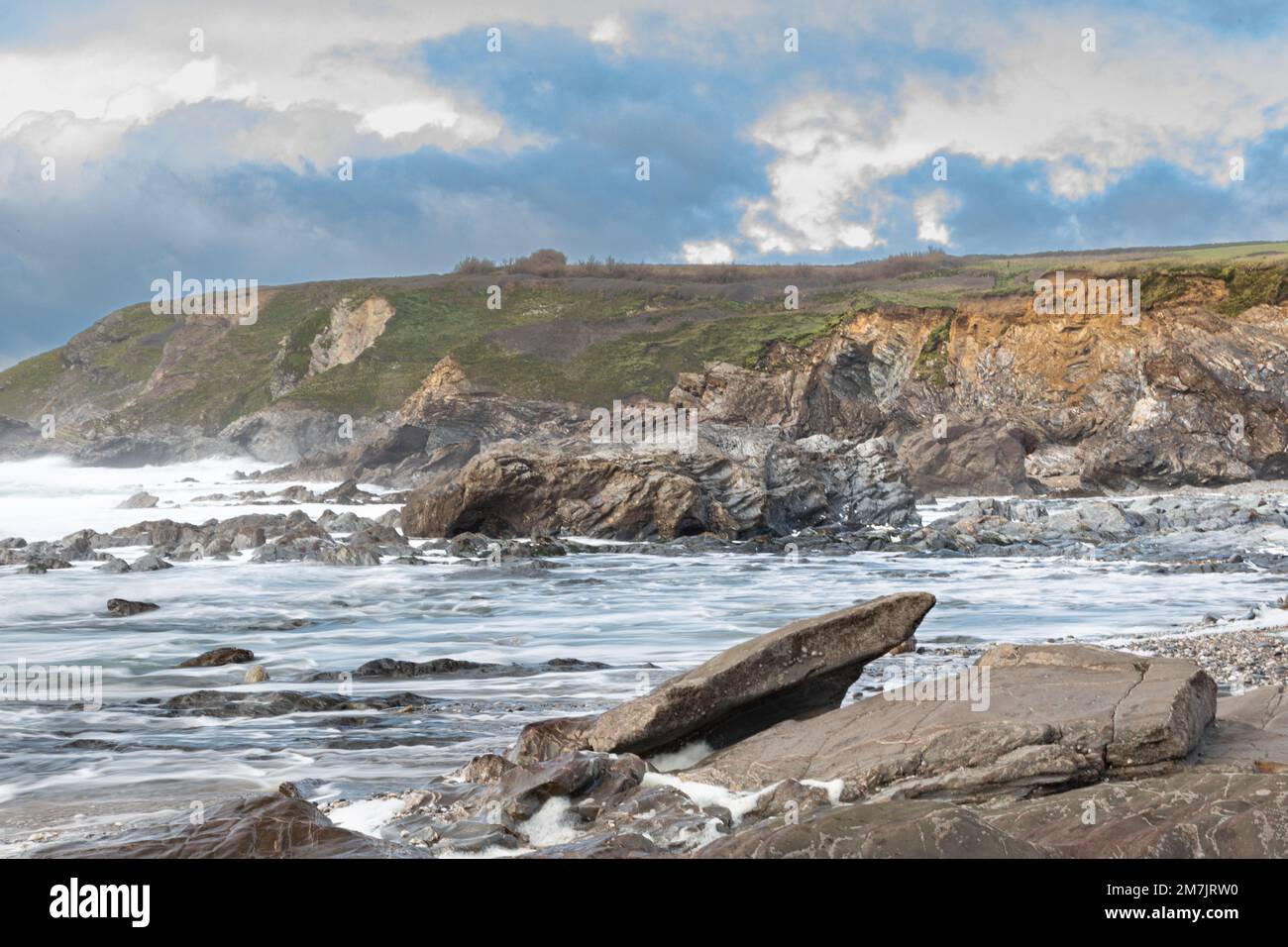 Storm approaching a rocky Cornish beach at Dollar Cove The Lizard Stock ...