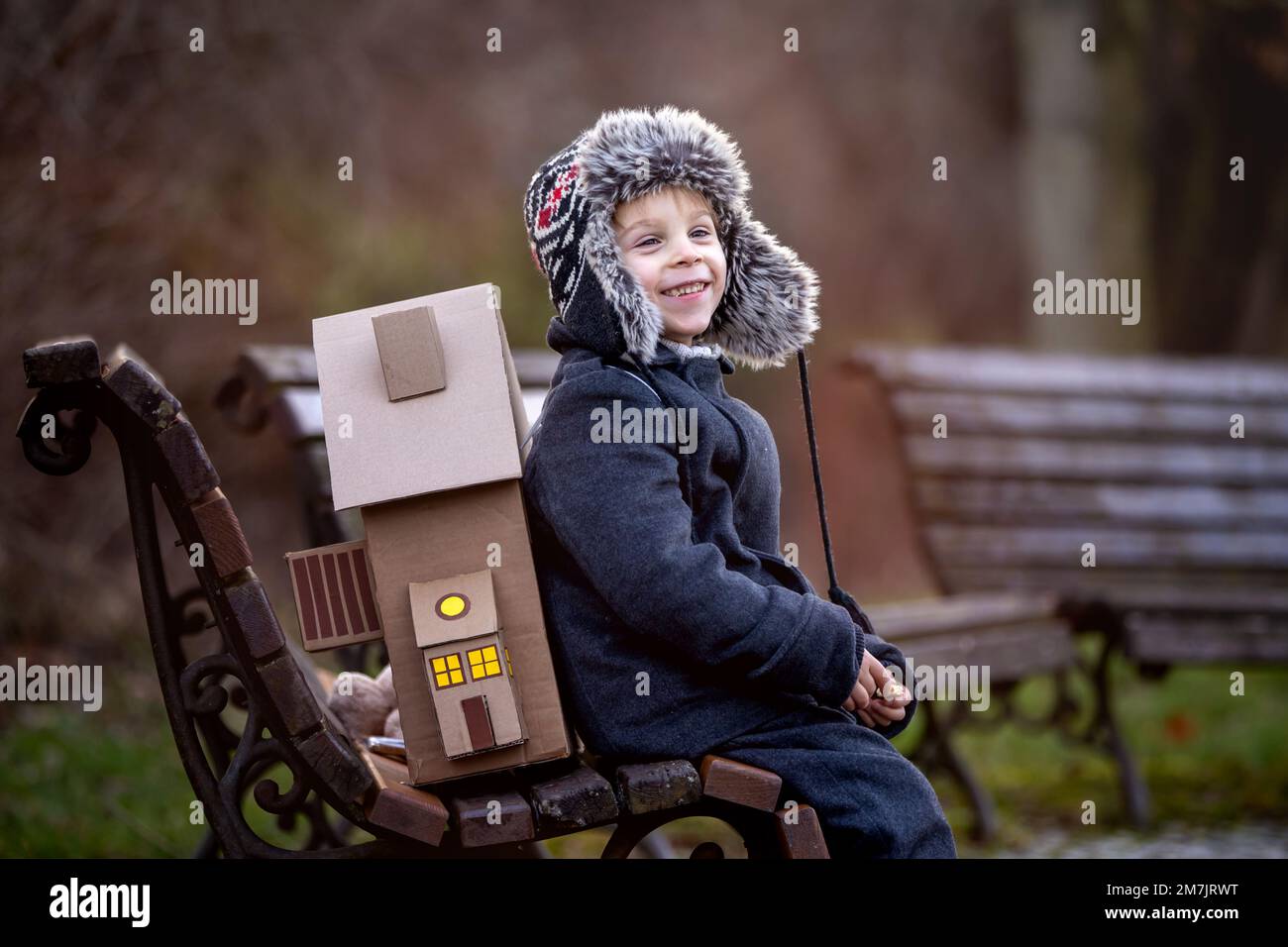 Little child, blond boy with pet dog, carying home on his back, kid ...