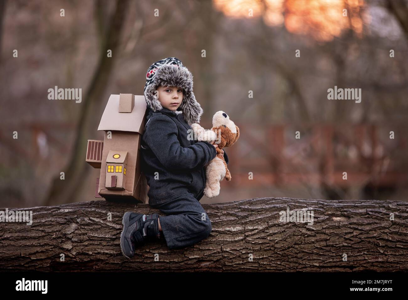 Little child, blond boy with pet dog, carying home on his back, kid ...