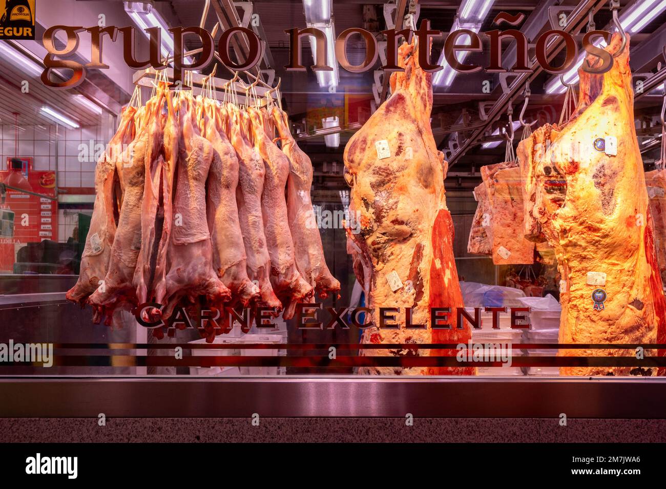 Cuts of fresh meat curing at largest wholesale food market in Spain ...
