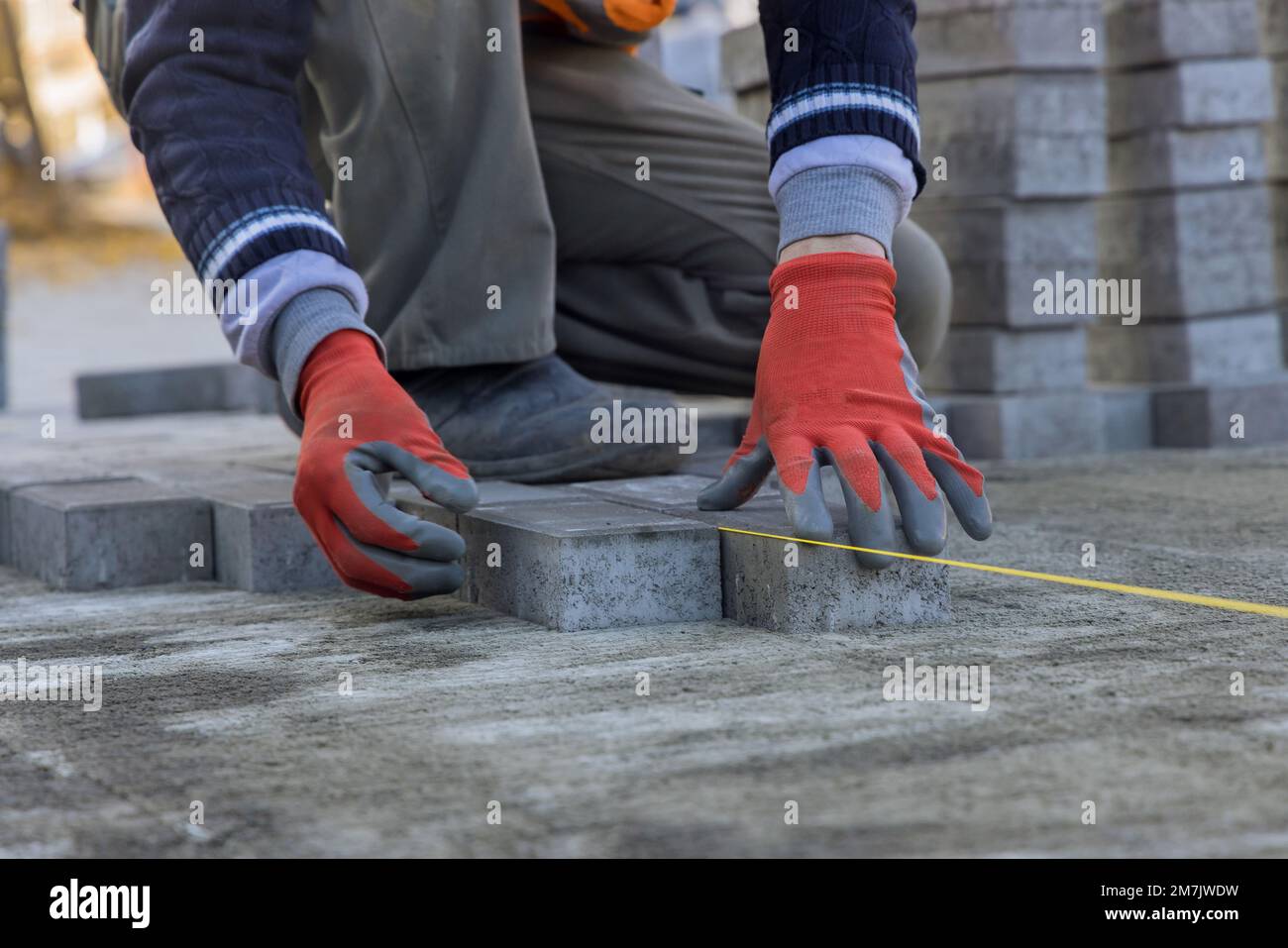 On sand foundation base of house courtyard master is laying gray ...