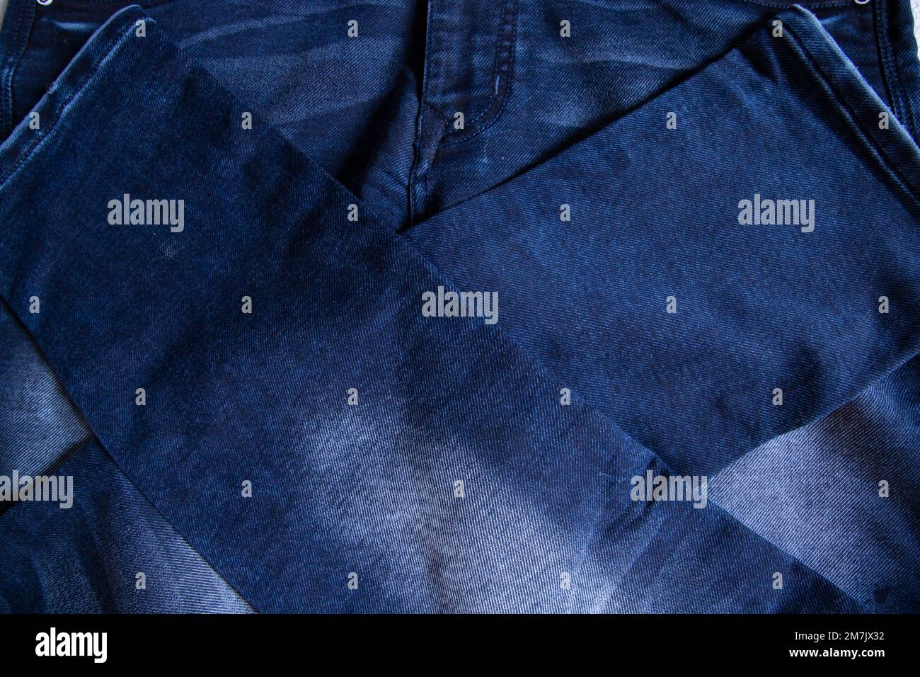 folded blue jeans pant pattern texture background Stock Photo - Alamy