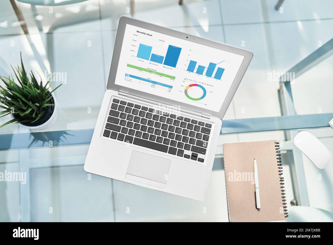 laptop and notepad on the office desk Stock Photo - Alamy