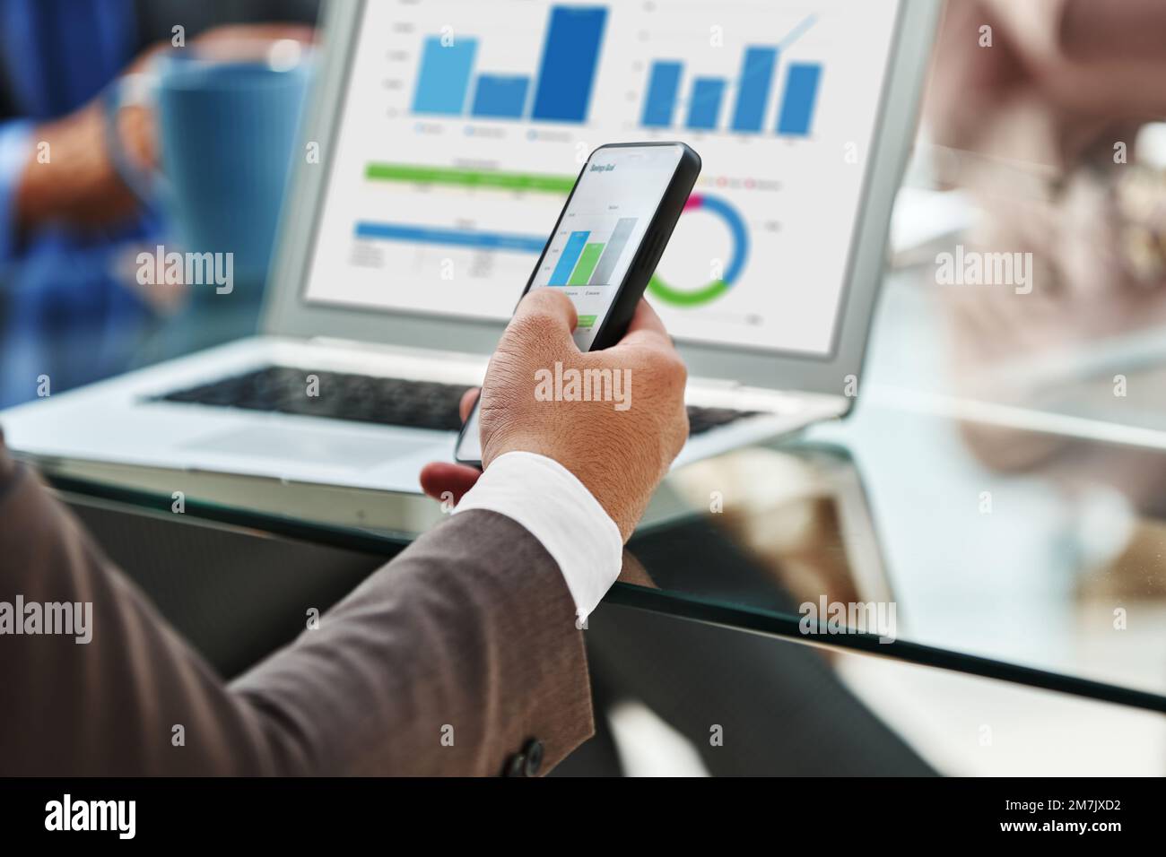 employees sitting at the office desk. close up Stock Photo - Alamy