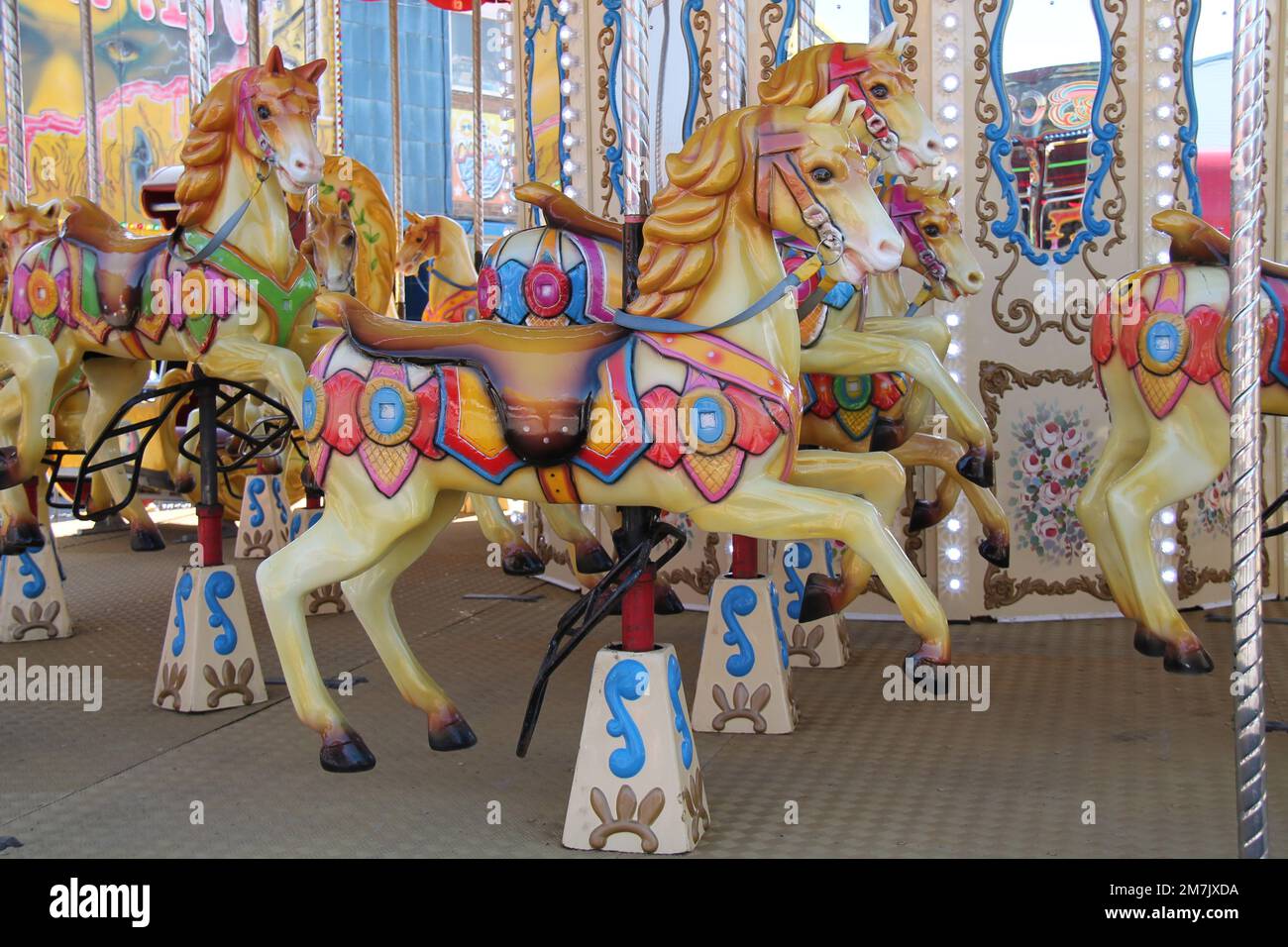 Brightly Decorated Horses on a Carousel Fun Fair Ride Stock Photo - Alamy