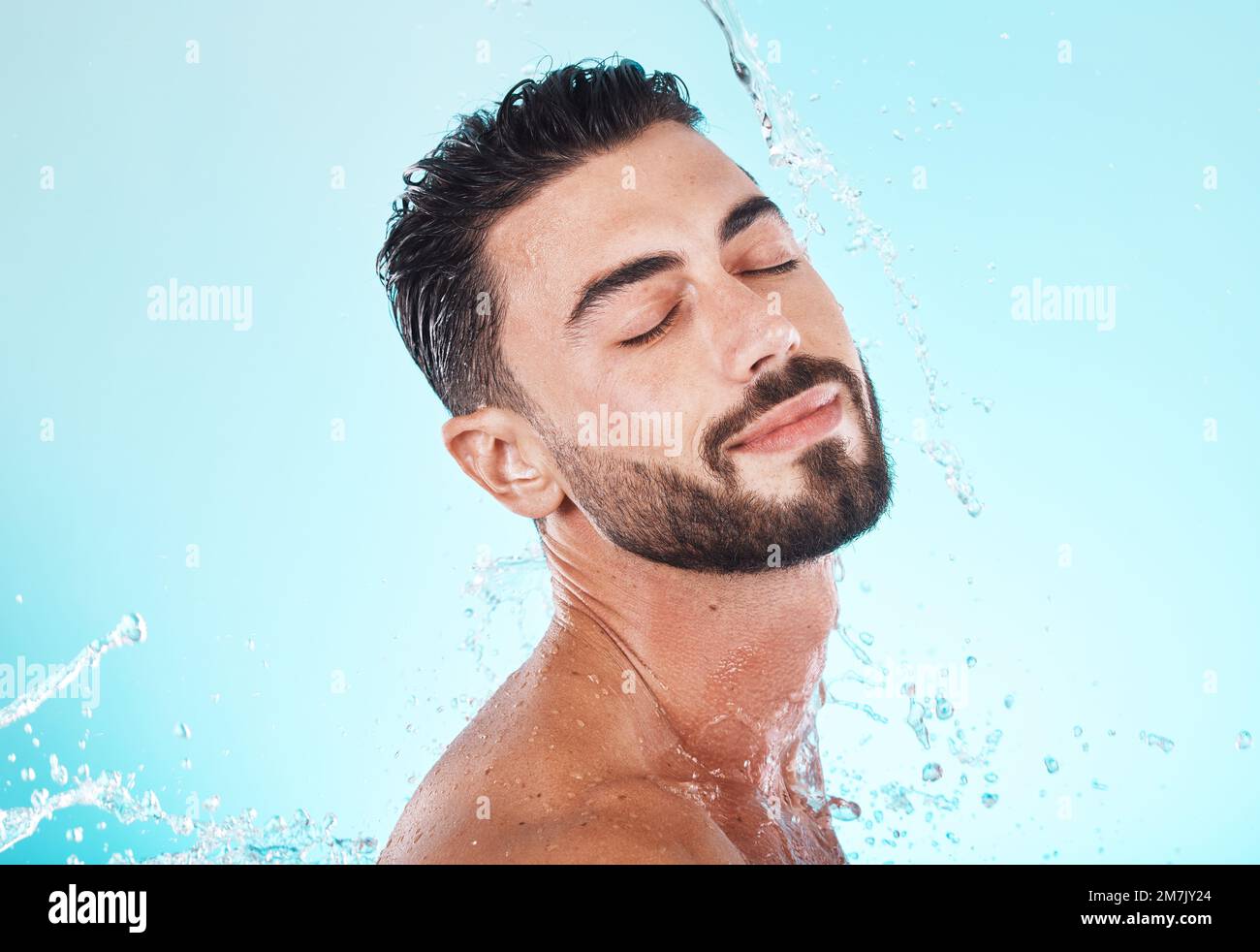 Water, splash and skincare with face of man for shower, self care and natural cosmetics. Luxury ...
