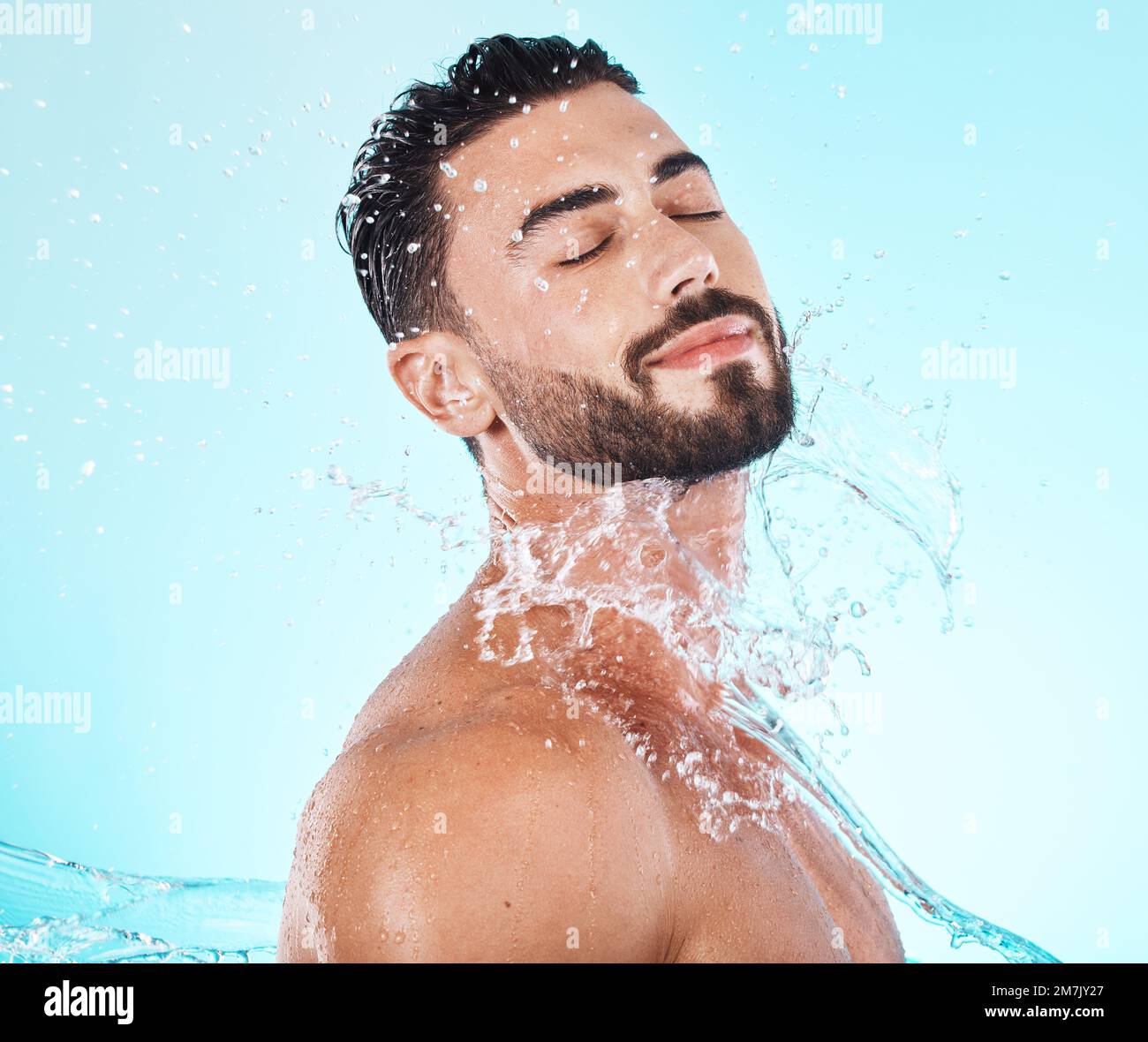 Water, splash and skincare with face of man for shower, self care and ...