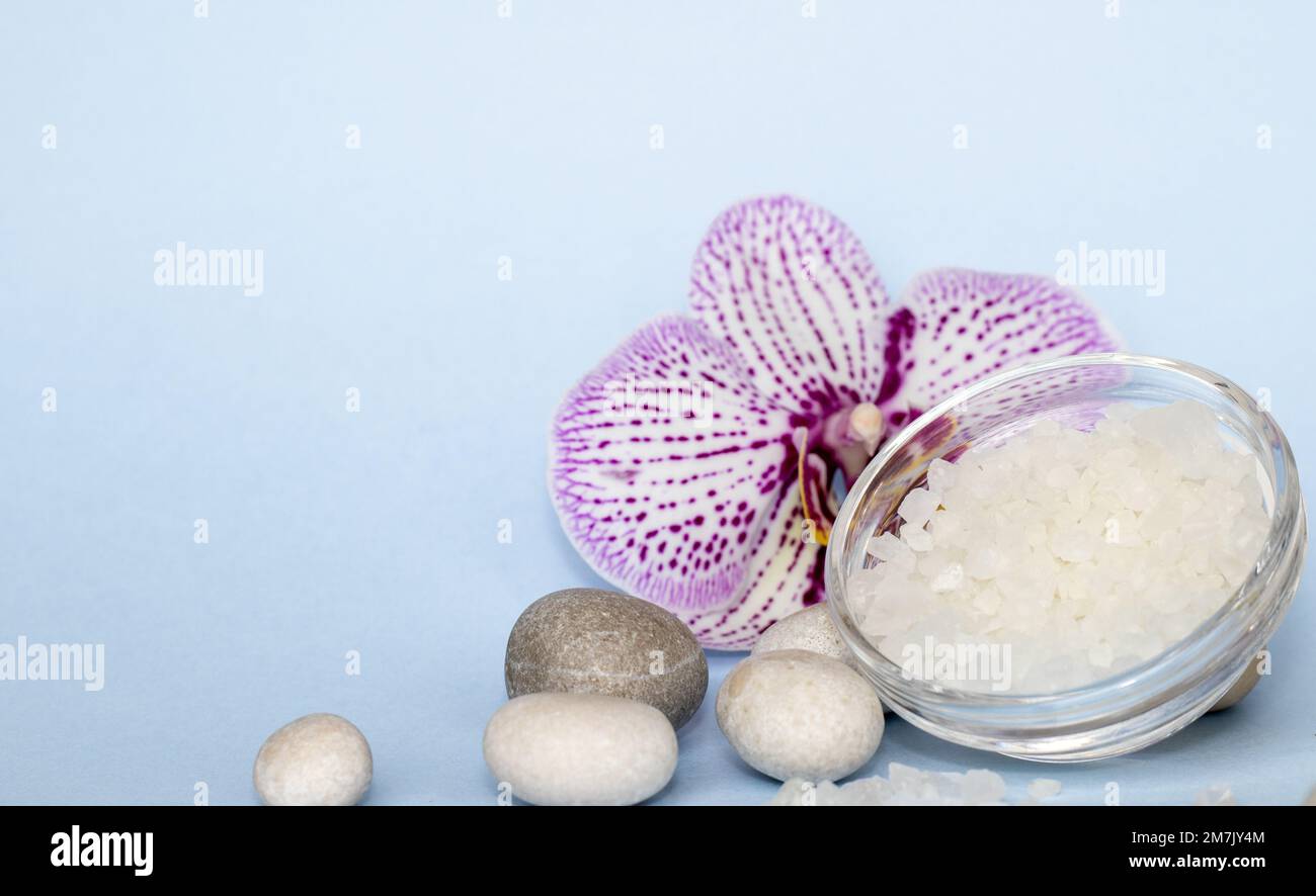 spa wellness concept.pebbles rocks in pyramid sea salt and orchid ...
