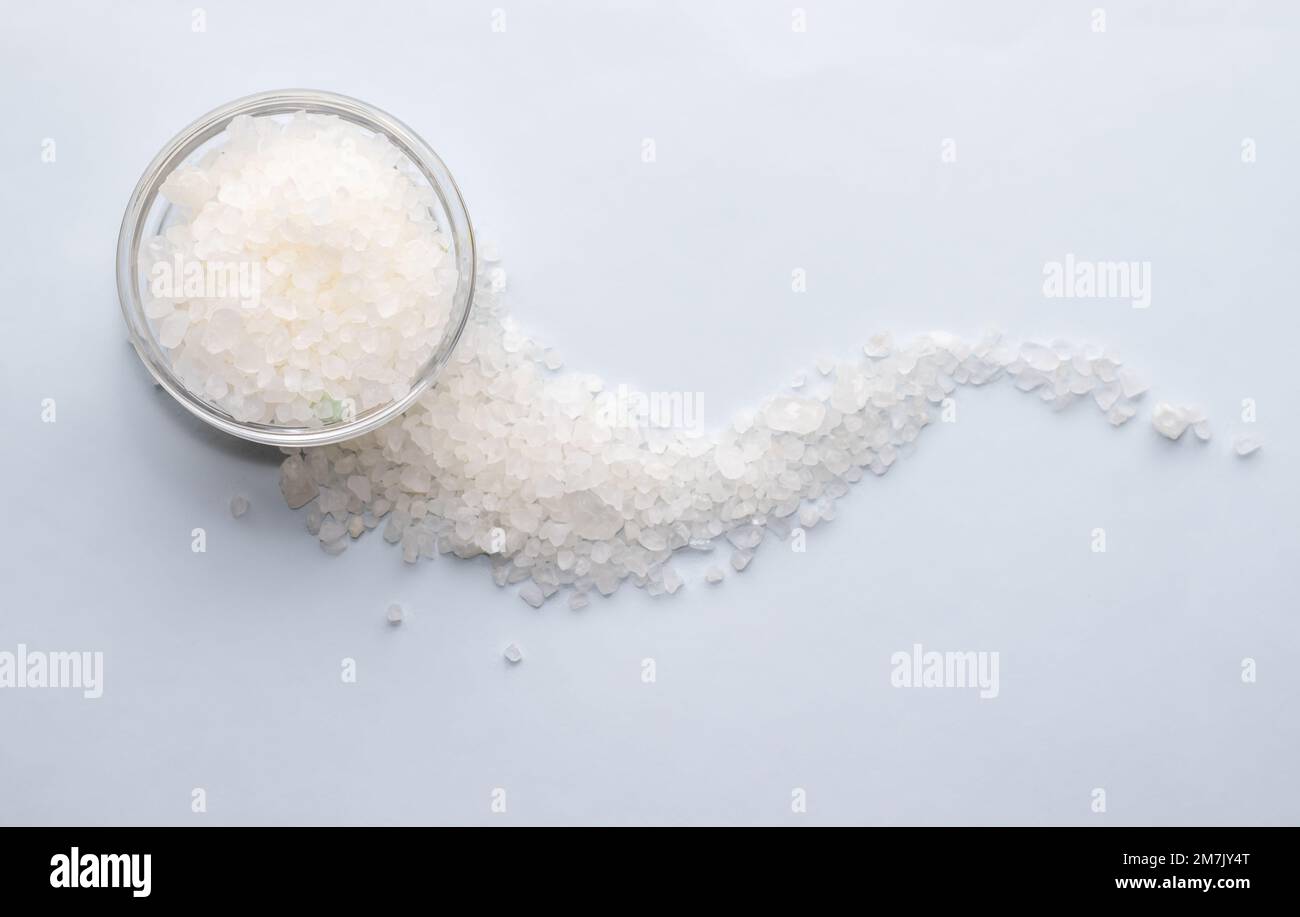 spa wellness concept.pebbles rocks in pyramid sea salt and orchid ...