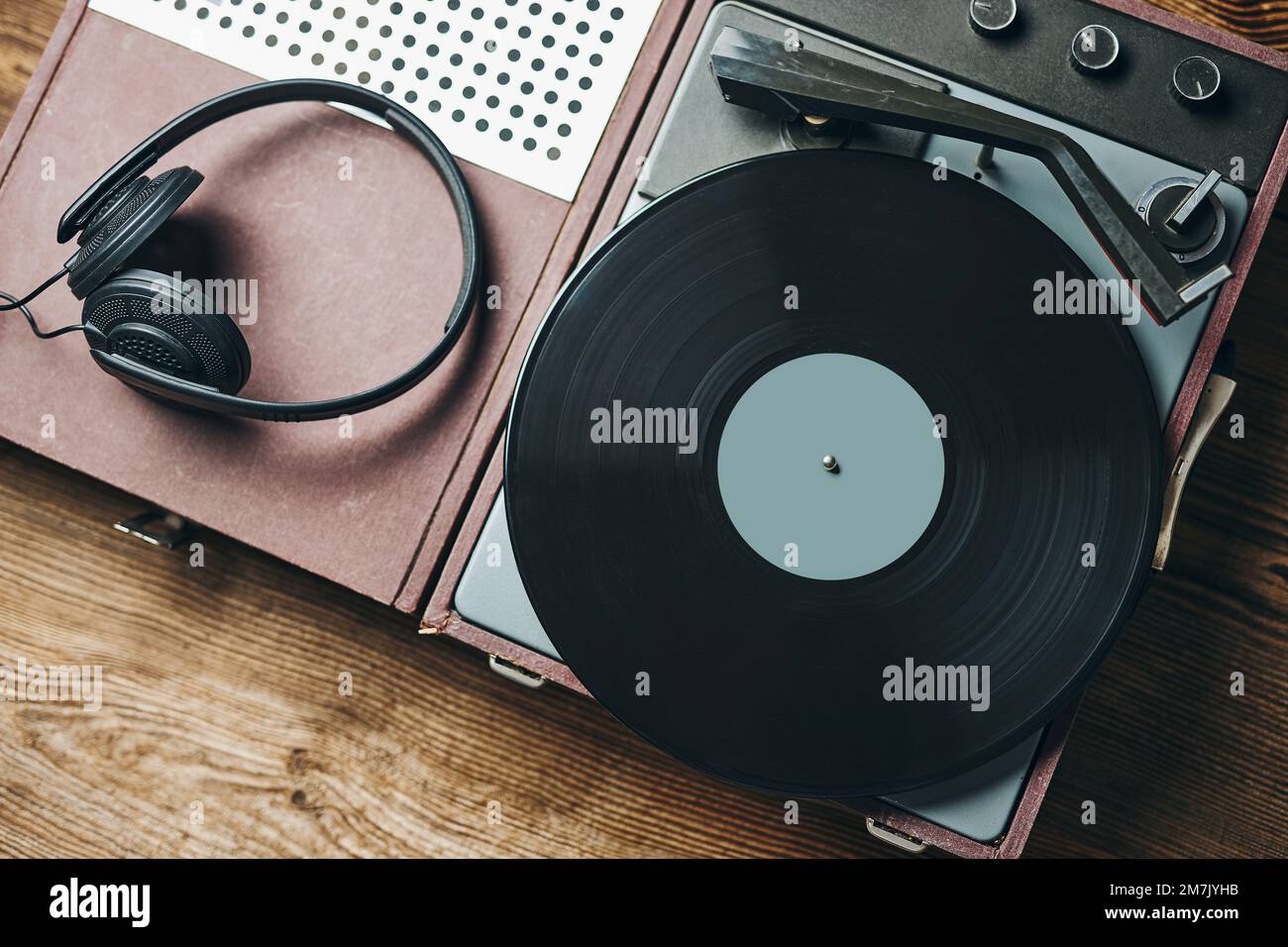 Listening to music from vinyl record. Playing music from analog disk on ...