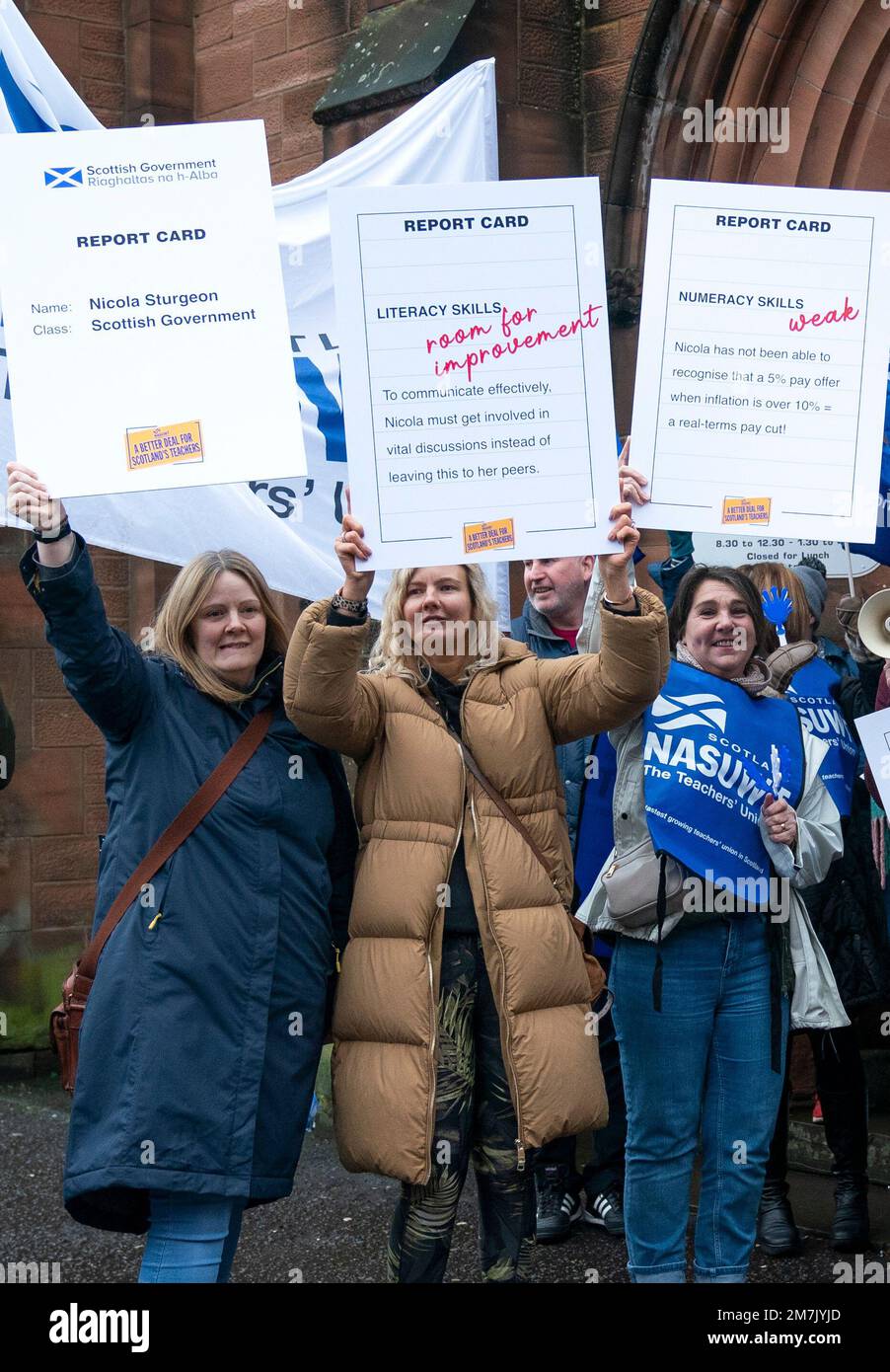 Members of NASUWT the Teachers' Union, deliver a 'report card' outside ...
