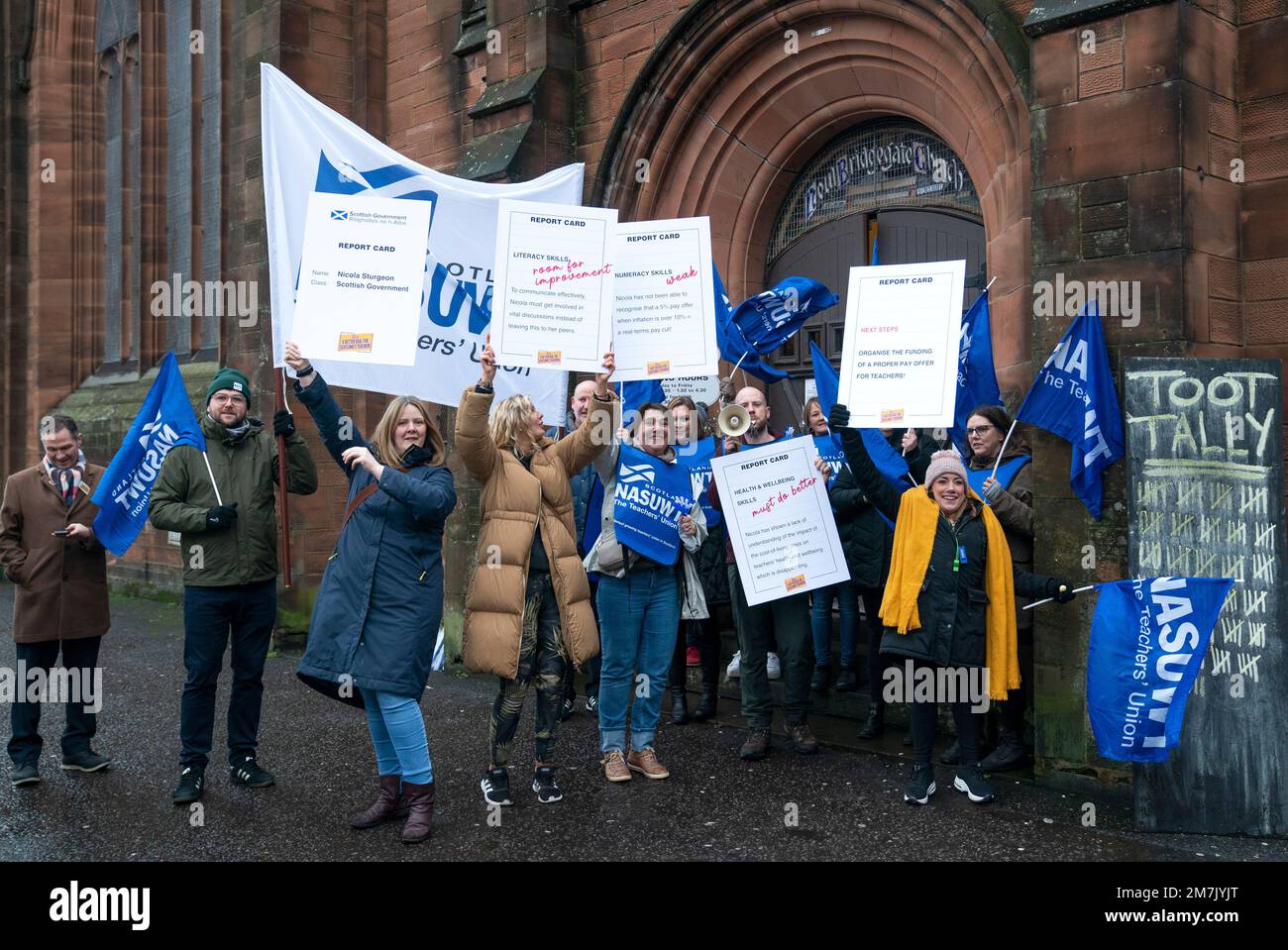 Members of NASUWT the Teachers' Union, deliver a 'report card' outside ...