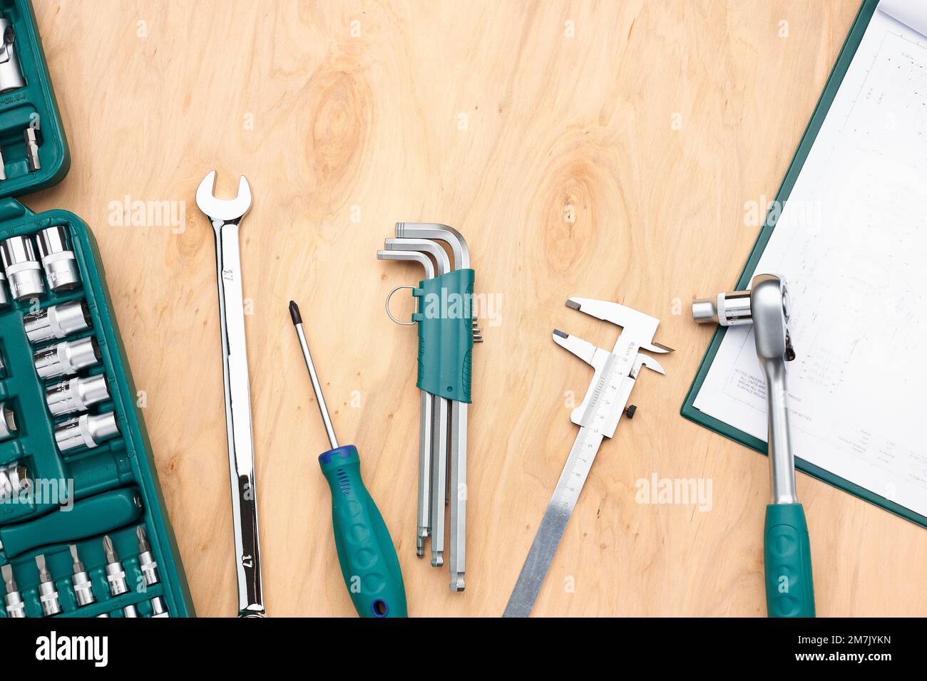 Workshop table with many tools. Wrench, spanner, calliper and ratchet ...