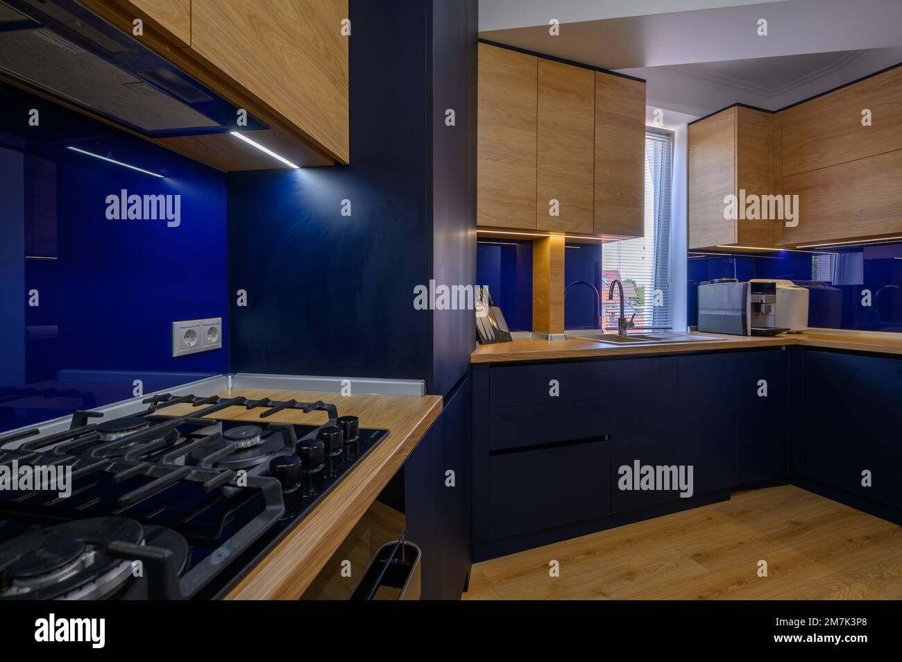 Closeup details of blue and wood colored kitchen Stock Photo - Alamy