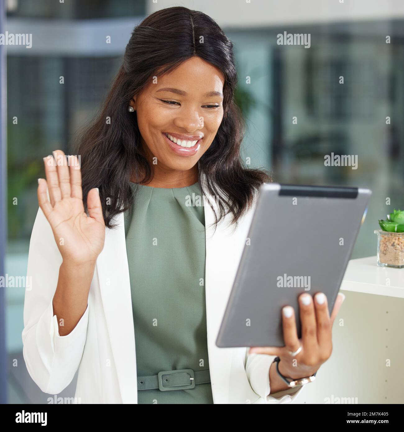 Tablet, wave and video call with a business black woman at work in her ...
