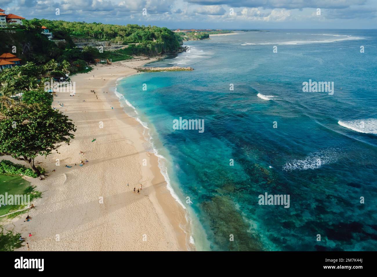 Tropical beach with blue ocean and waves in Bali island. Aerial view ...