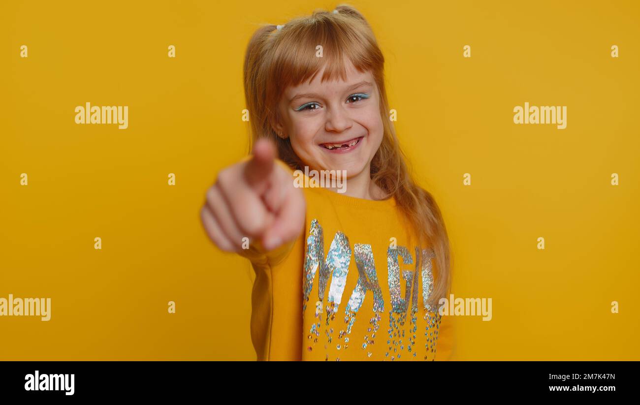 Amused young preteen child girl kid pointing finger to camera, laughing ...
