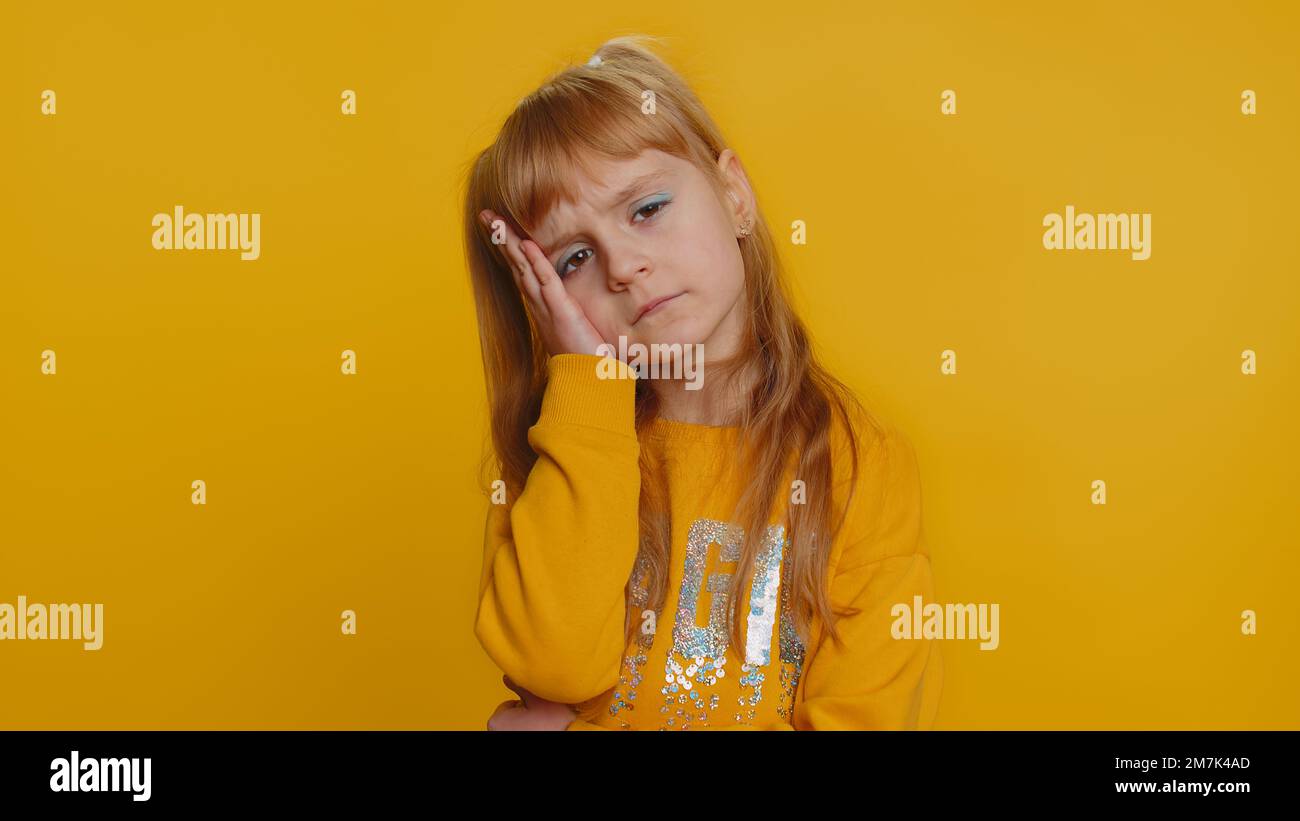 Displeased child girl kid rubbing temples to cure headache problem ...