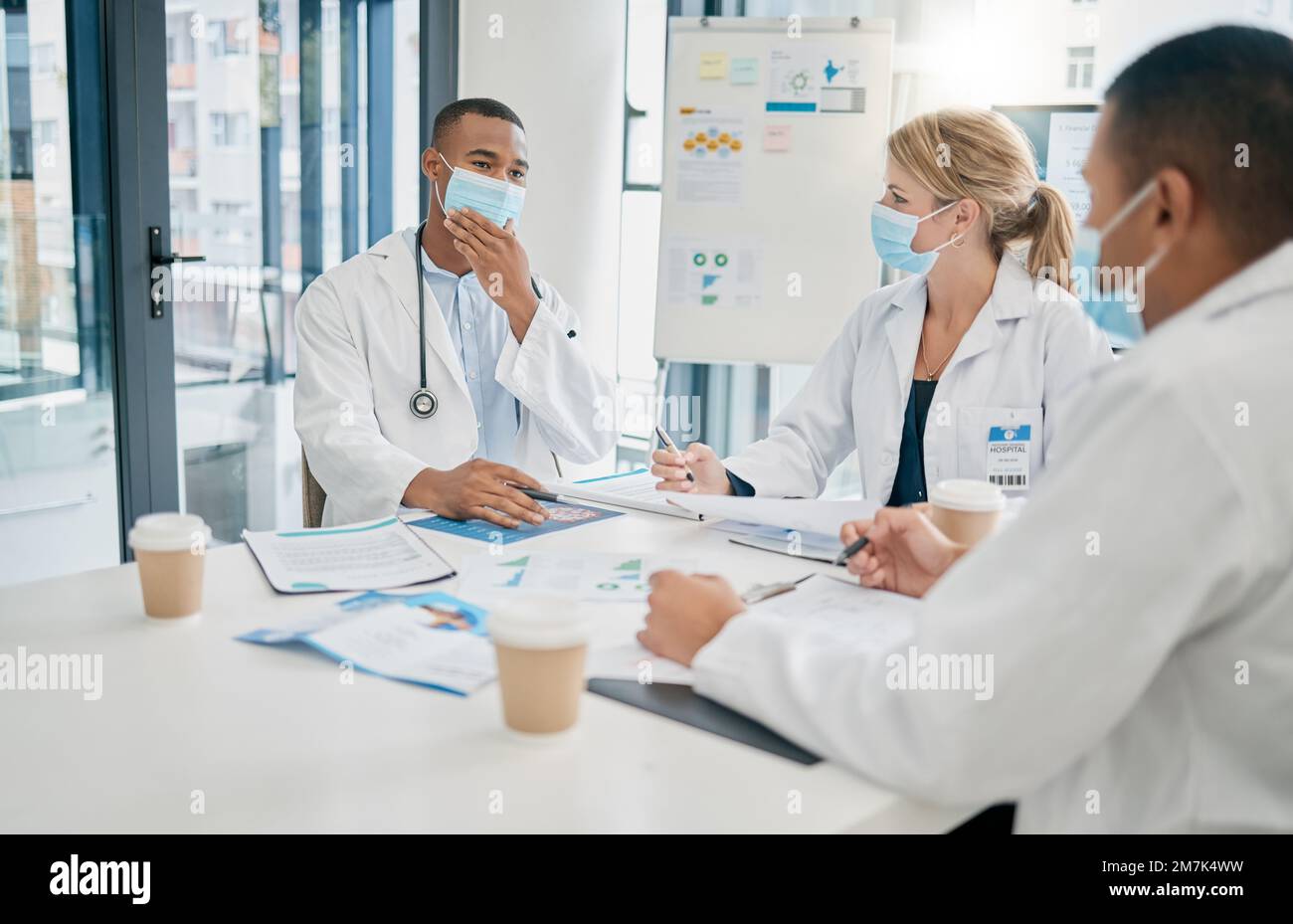 Medical, covid and chart with doctors in meeting for planning, strategy ...