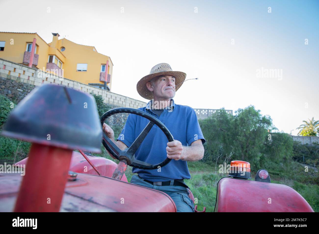 Farmer riding tractor hi-res stock photography and images - Alamy
