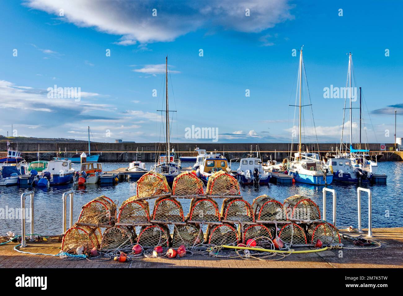 Hopeman village Moray Coast Scotland the main harbour with crab creels ...