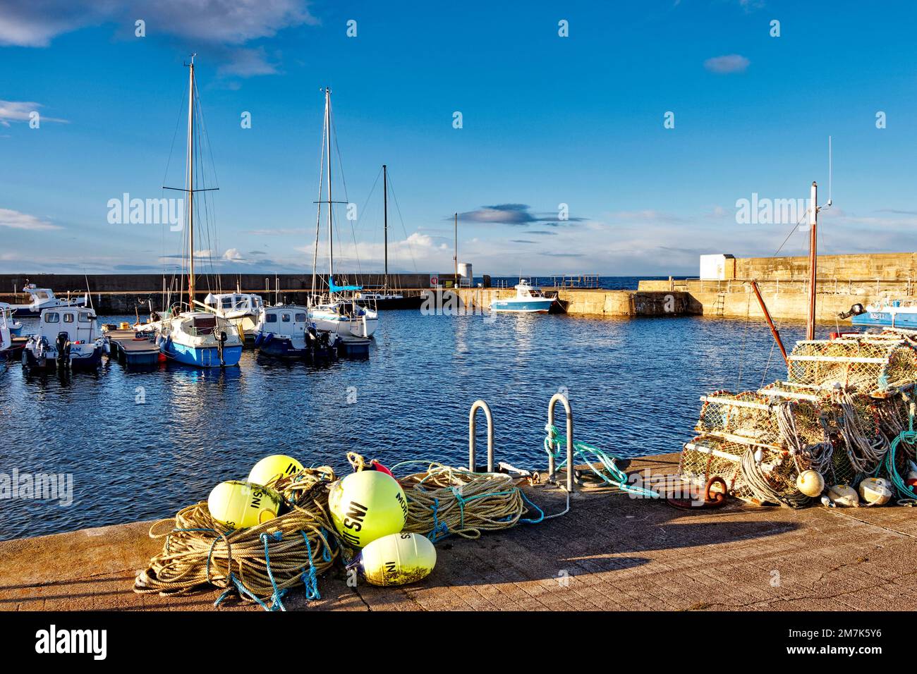 Hopeman village Moray Coast Scotland the main harbour with moored boats ...