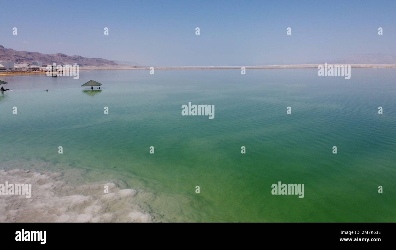 Desert view with dead sea green water. Taken by aerial footage perfect ...