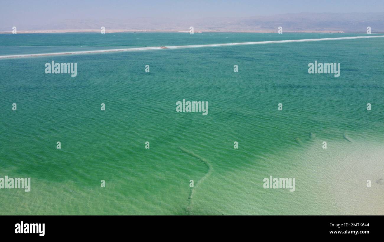 Desert view with dead sea green water. Taken by aerial footage perfect ...