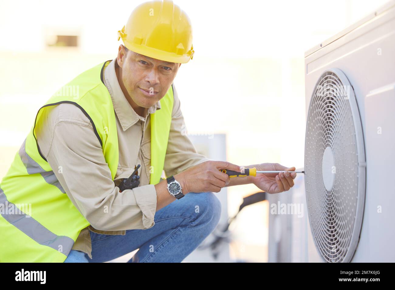 Air conditioner, repair and portrait of man on roof for maintenance ...