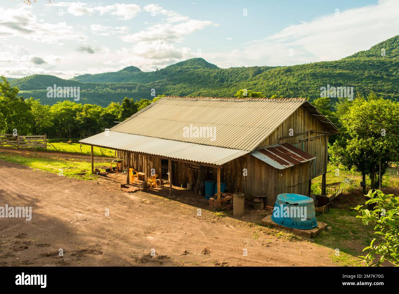 Rustic wooden house with fiber cement roofing in the countryside of Sao ...