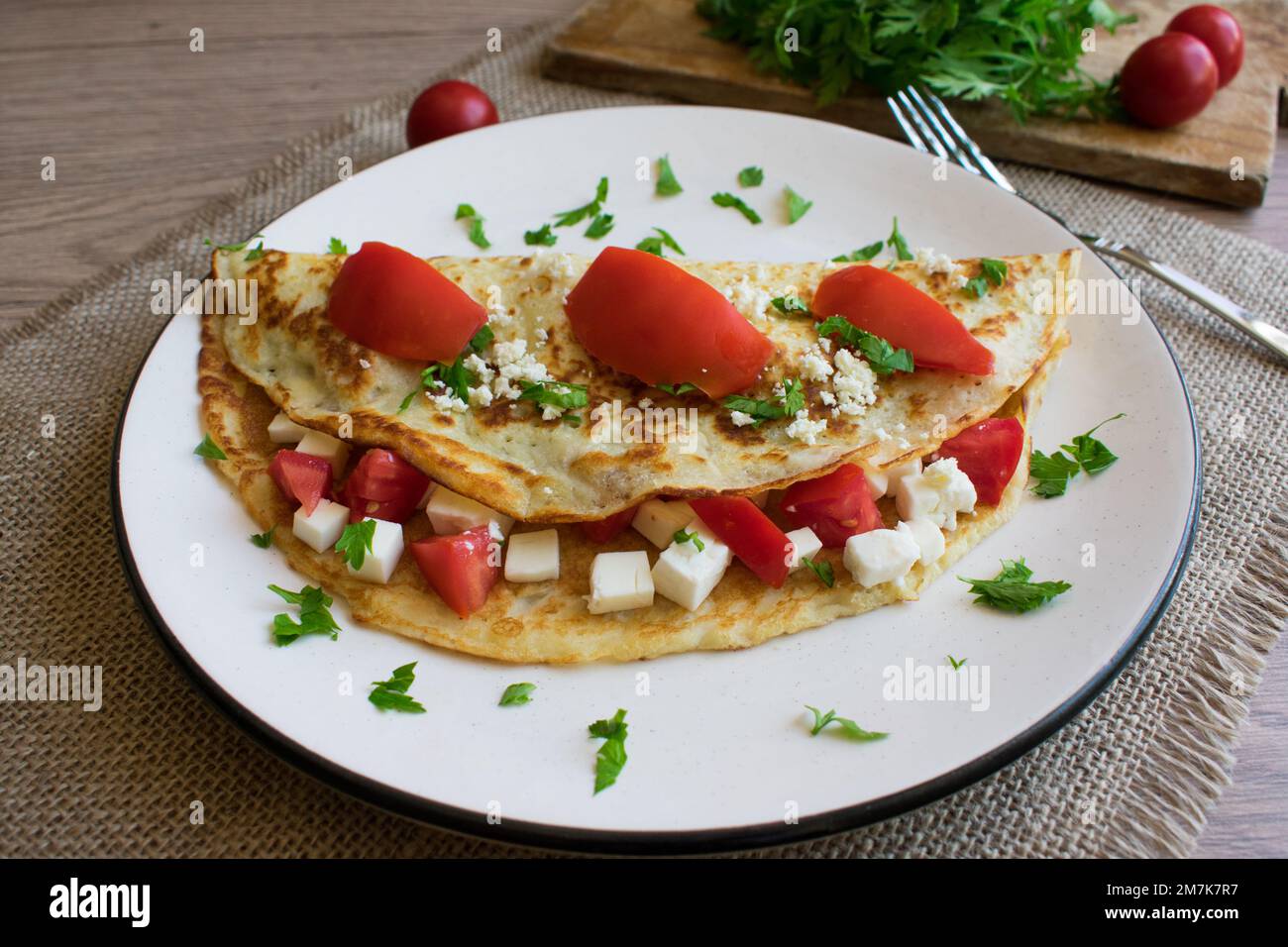 Cheese crepe, homemade cheese tomato crepe presentation Stock Photo - Alamy