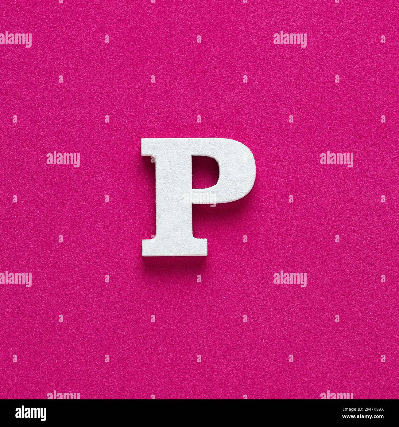 Letter P uppercase - White wood font on rhodamine red background Stock ...
