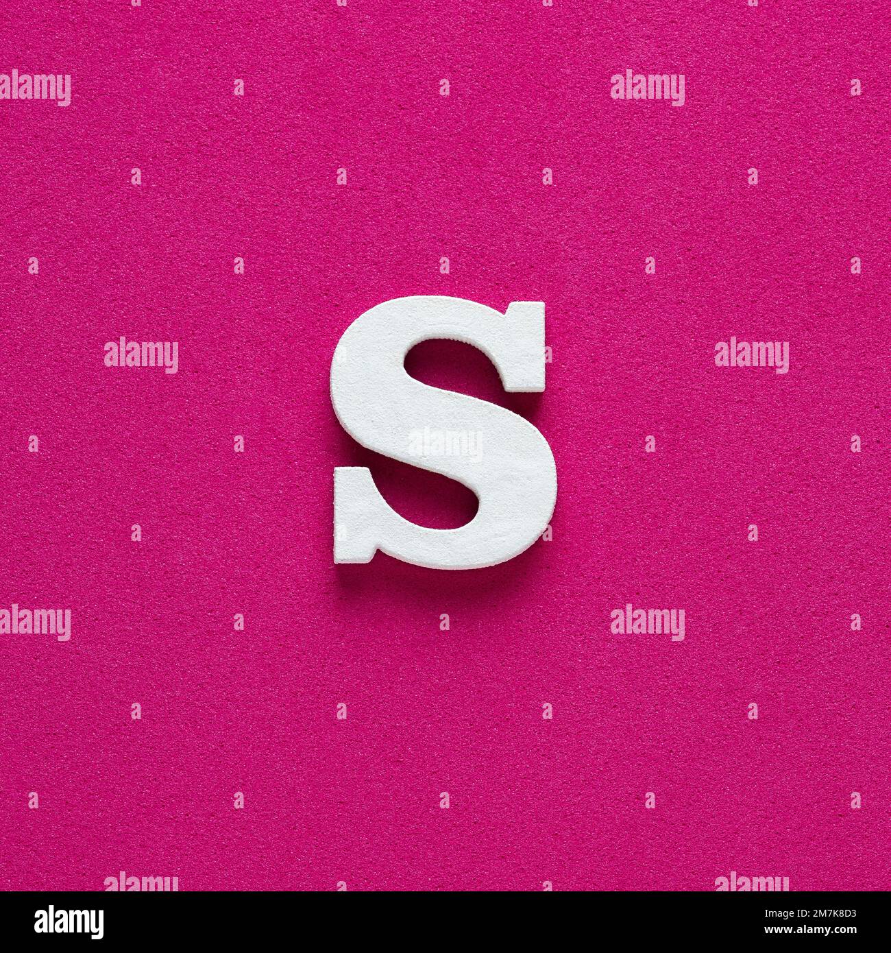 Alphabet letter S - White wooden letter on rhodamine red background ...