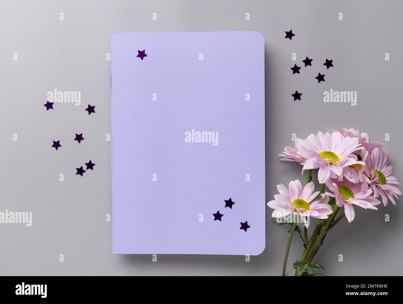 pastel violet blank notebook, flowers and stars confetti Stock Photo ...