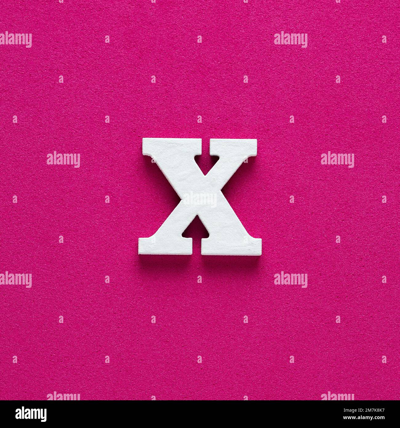 Letter X uppercase - White wood font on rhodamine red background Stock ...