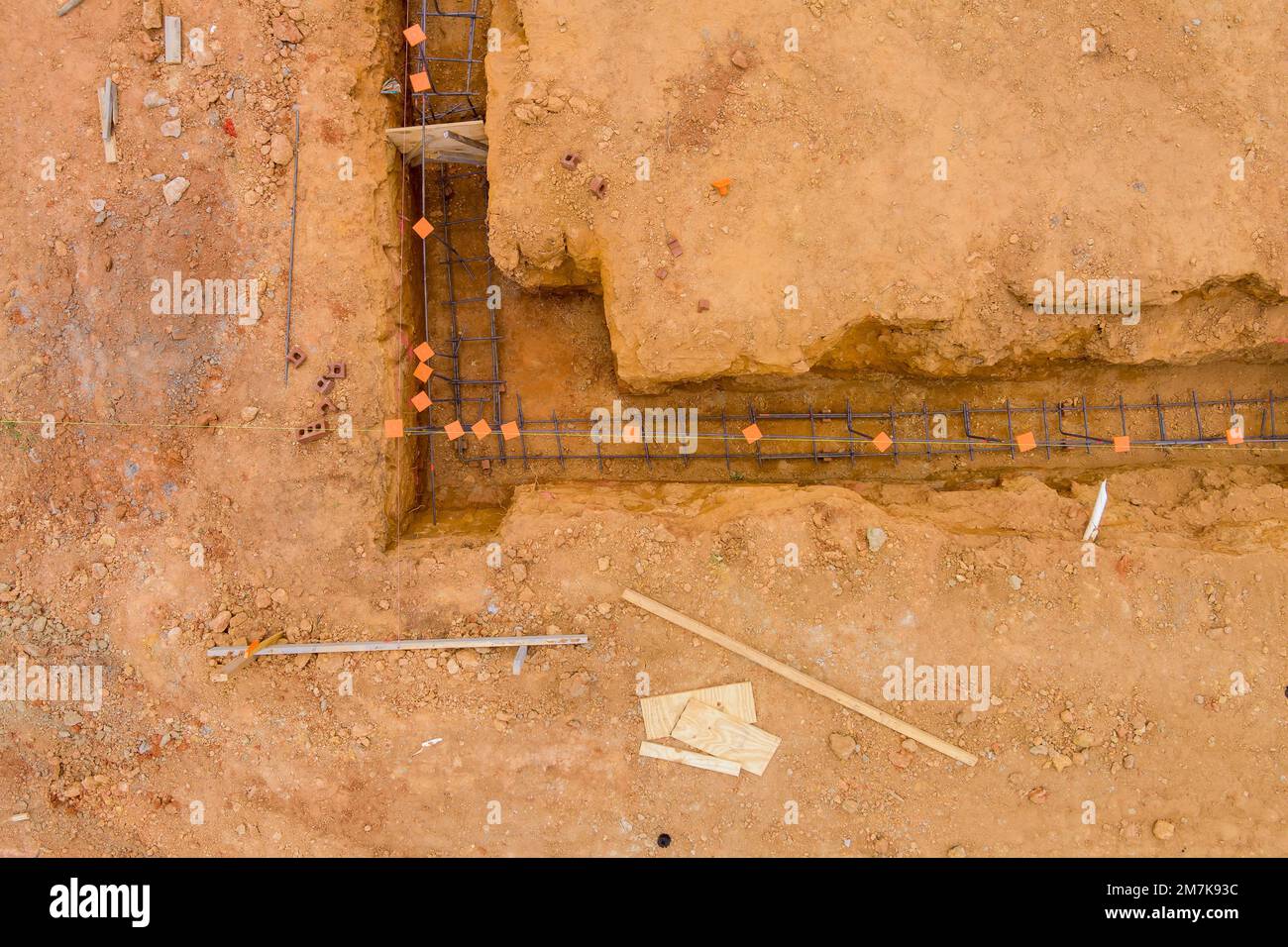 Performing works of putting steel in trench for house foundation on ...