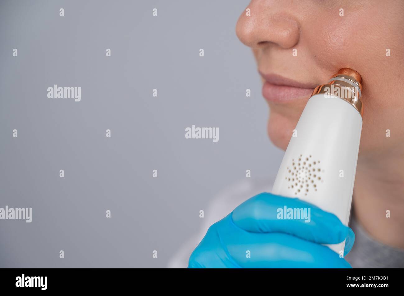 Caucasian woman uses a vacuum pore cleaner at home Stock Photo - Alamy