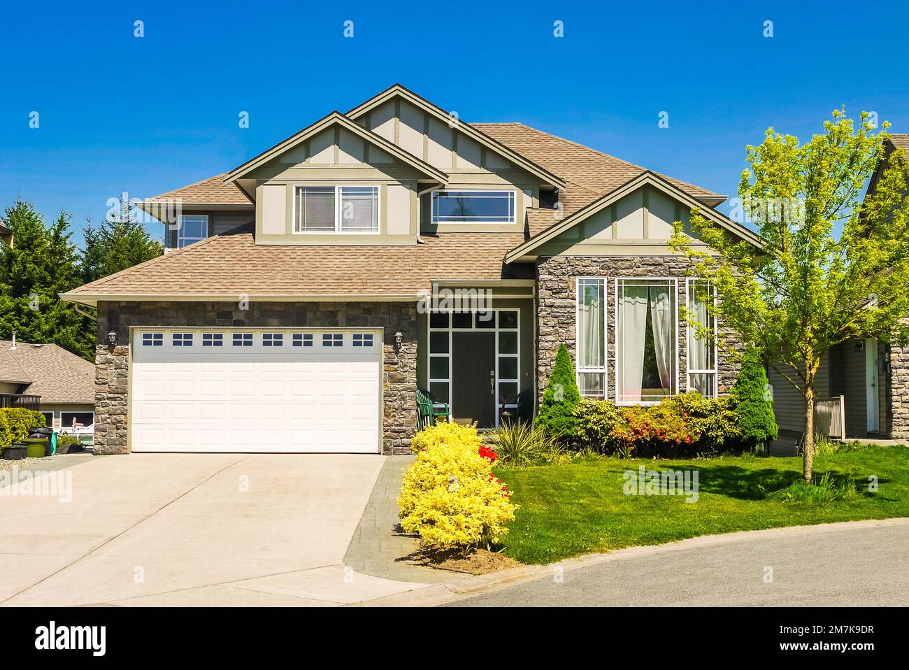 Big family house with concrete driveway to double size garage Stock ...