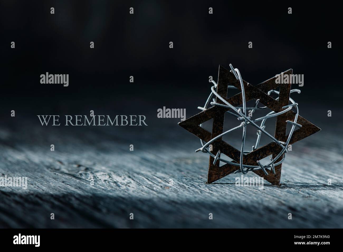 the text we remember and an old star of david tied with some barbed ...